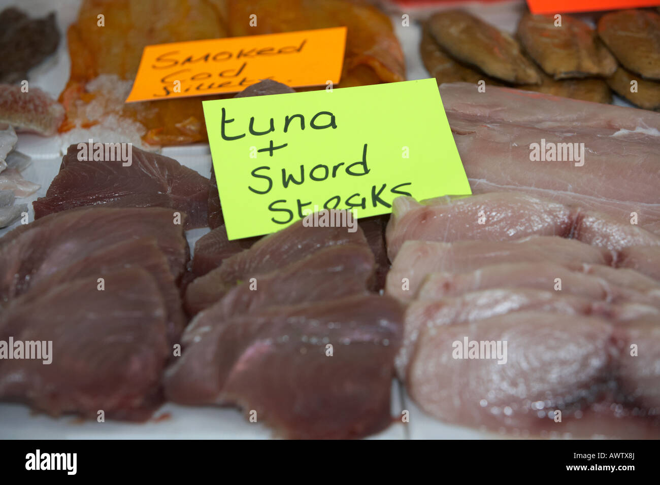 tuna and swordfish sword steaks on a fishmongers fresh fish stall at an ...