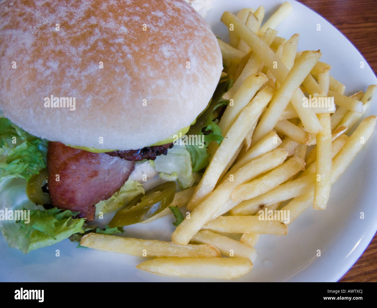 Beefburger and chips on a plate in pub - pub grub dinner Stock Photo ...