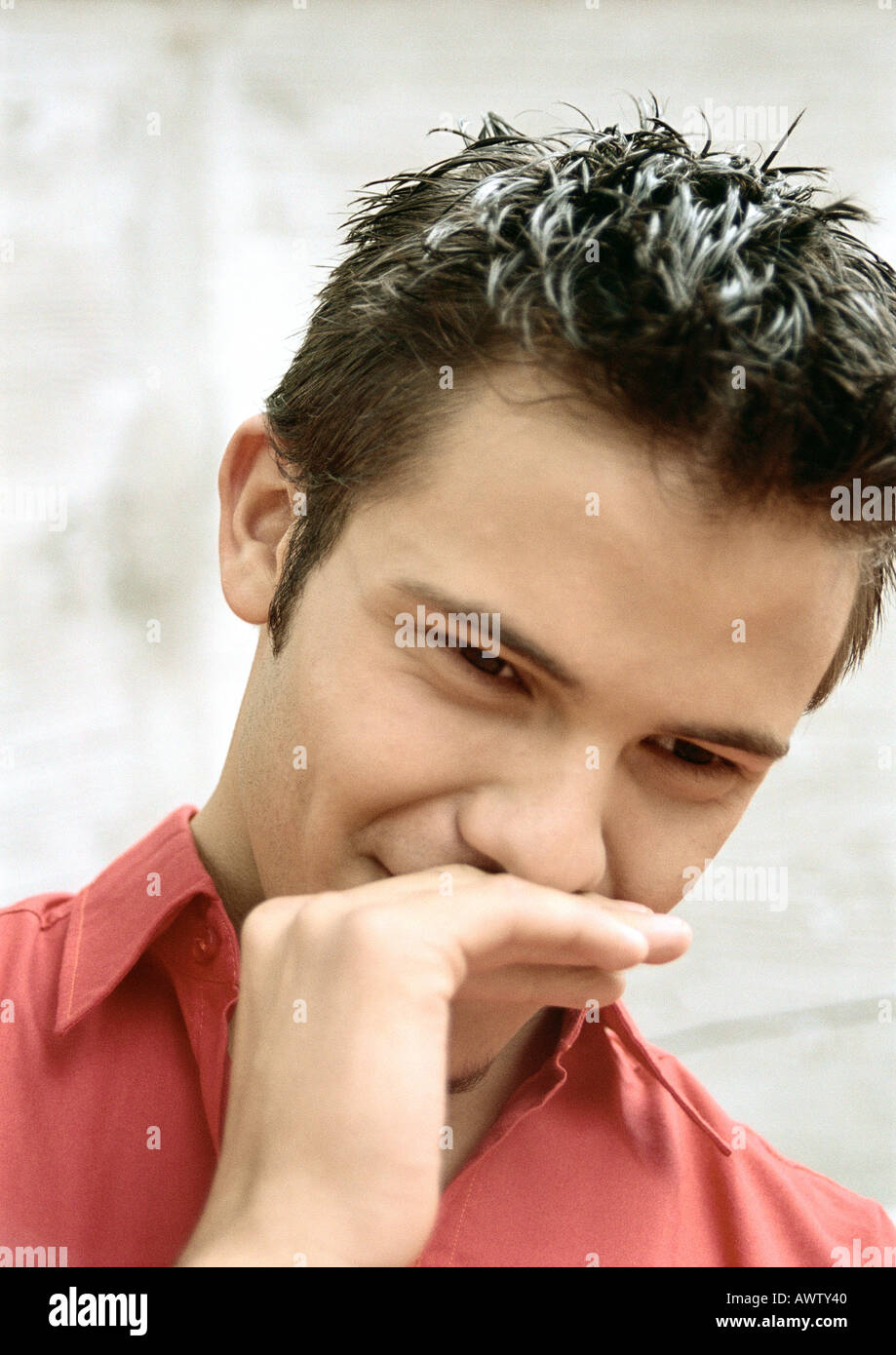 Man holding hand to face, portrait Stock Photo - Alamy