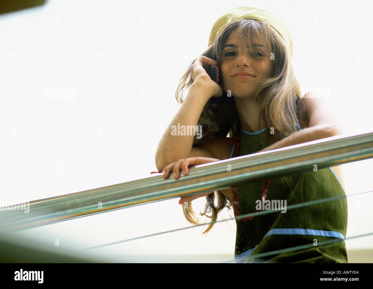 Woman leaning on hand rail hi-res stock photography and images - Alamy