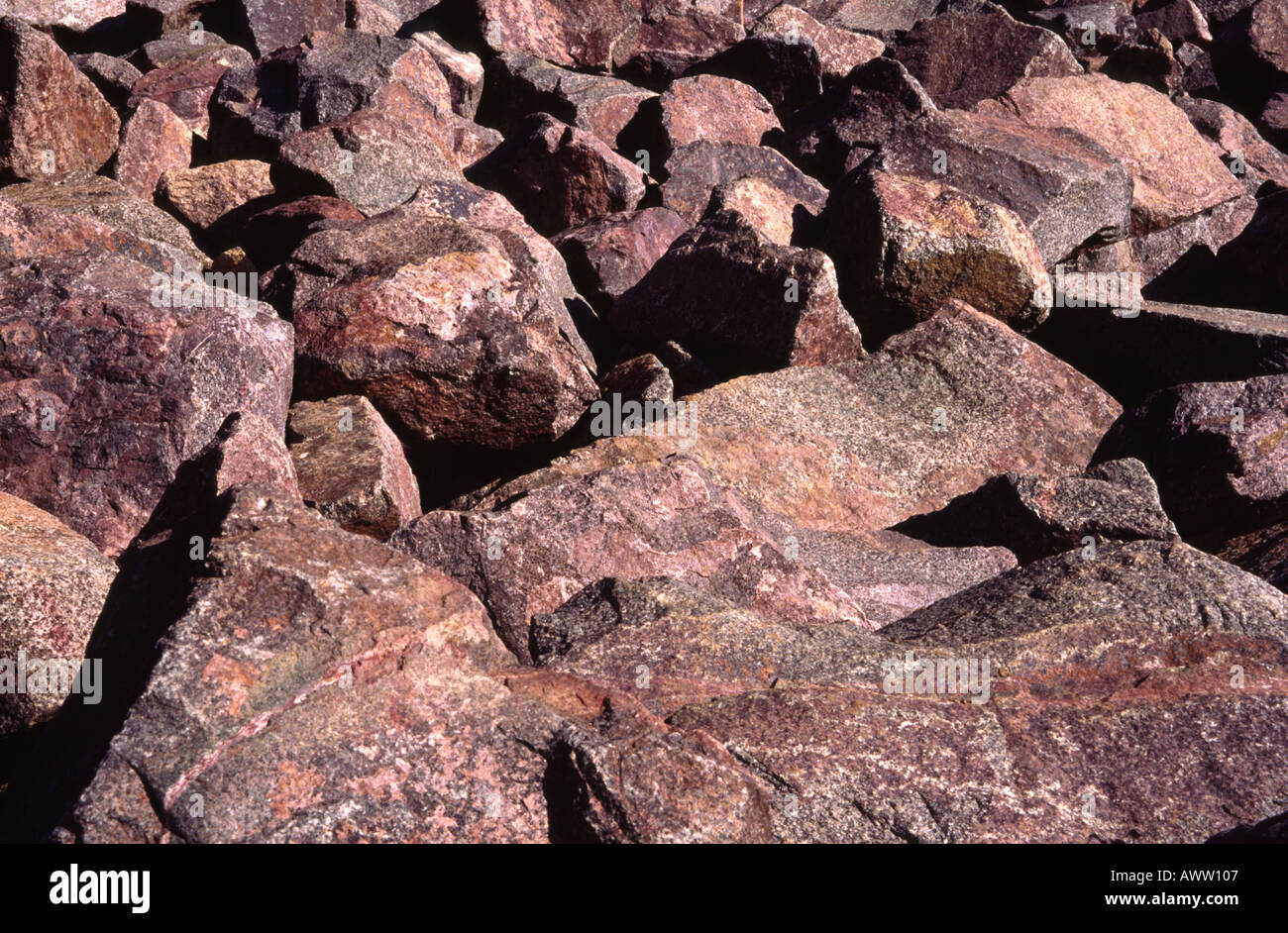 Large rough stone break water Stock Photo - Alamy