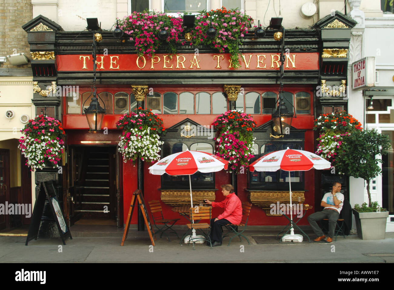 Covent Garden The Opera Tavern decorated with summer hanging flower ...