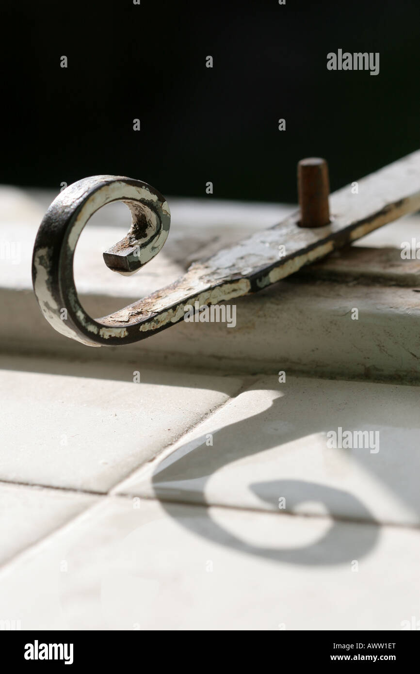 White spiral window latch holding unseen window open Stock Photo - Alamy