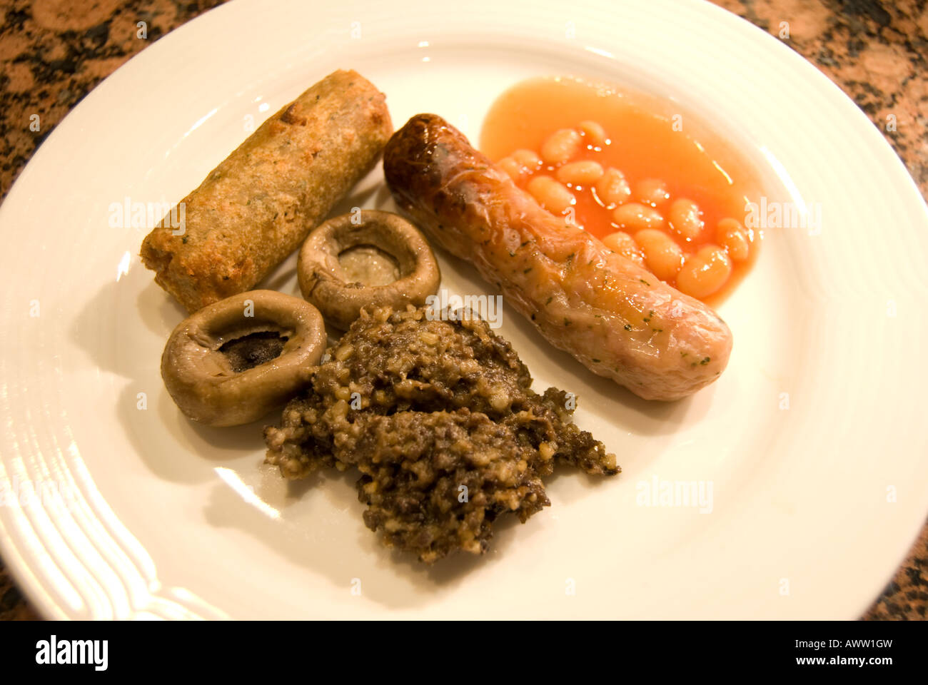 Scottish breakfast of Haggis, sausage, baked beans, mushrooms at a ...