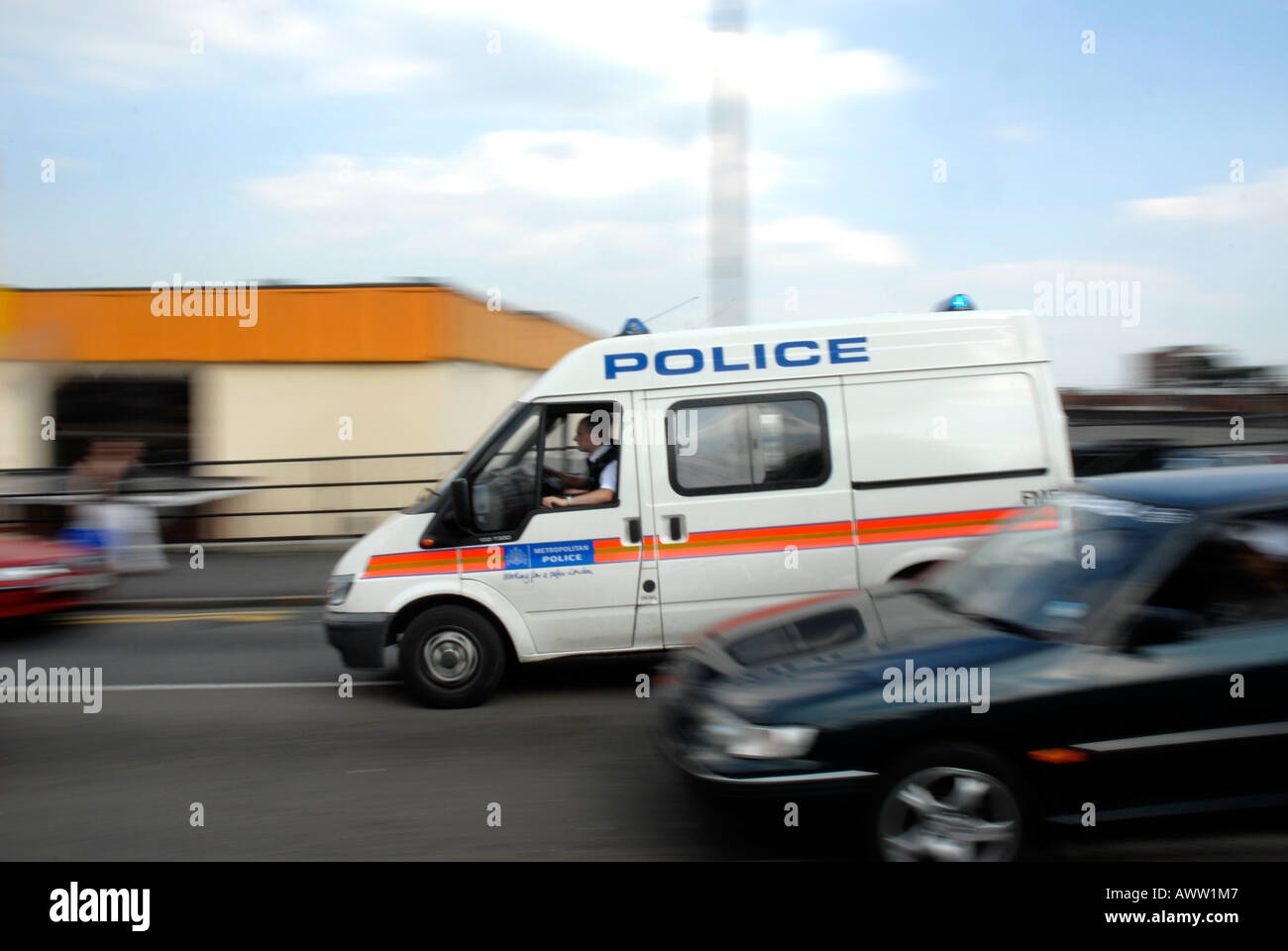 Police vehicle at speed in Southall Middlesex Stock Photo - Alamy