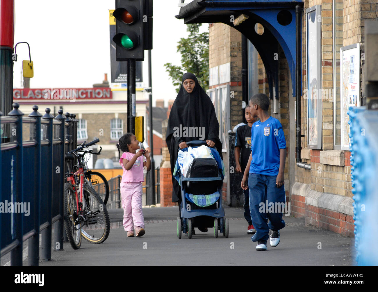Street scene of people in Southall Middlesex Stock Photo - Alamy
