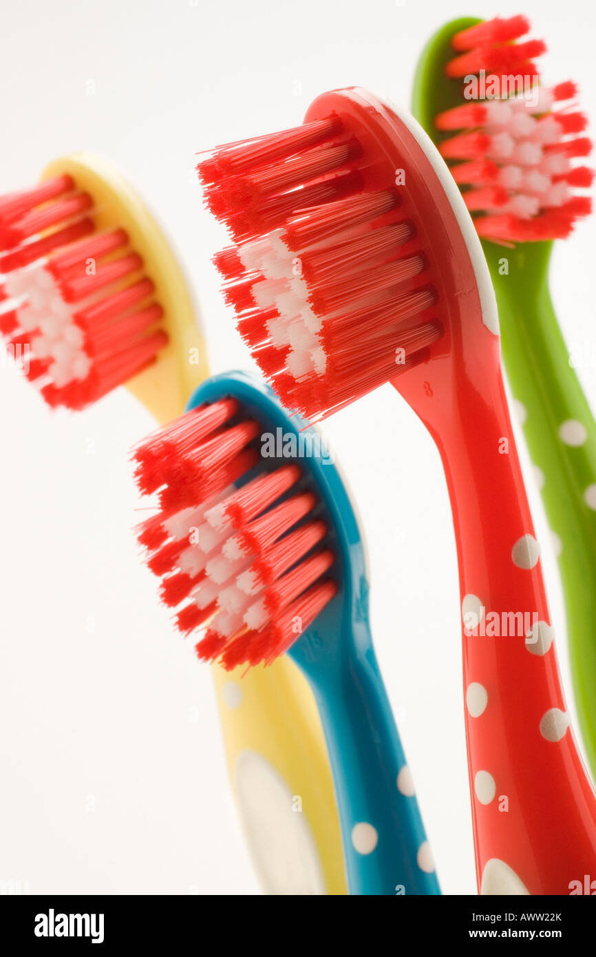 Group of four colorful children s toothbrushes on a white background ...