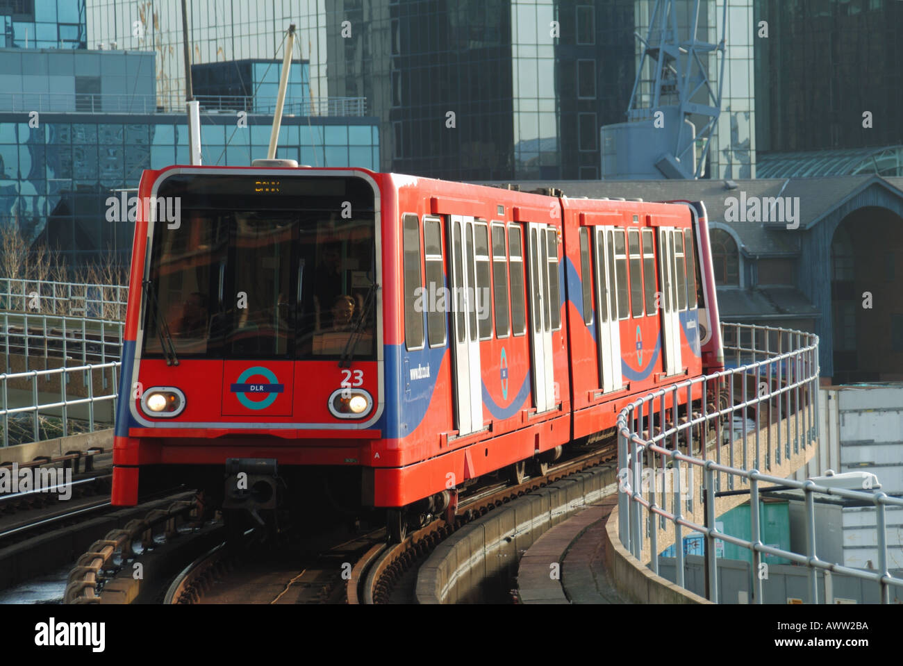 London Docklands Light railway train running on above street level ...