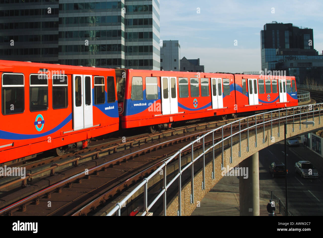 London Docklands Light railway train running on above street level ...