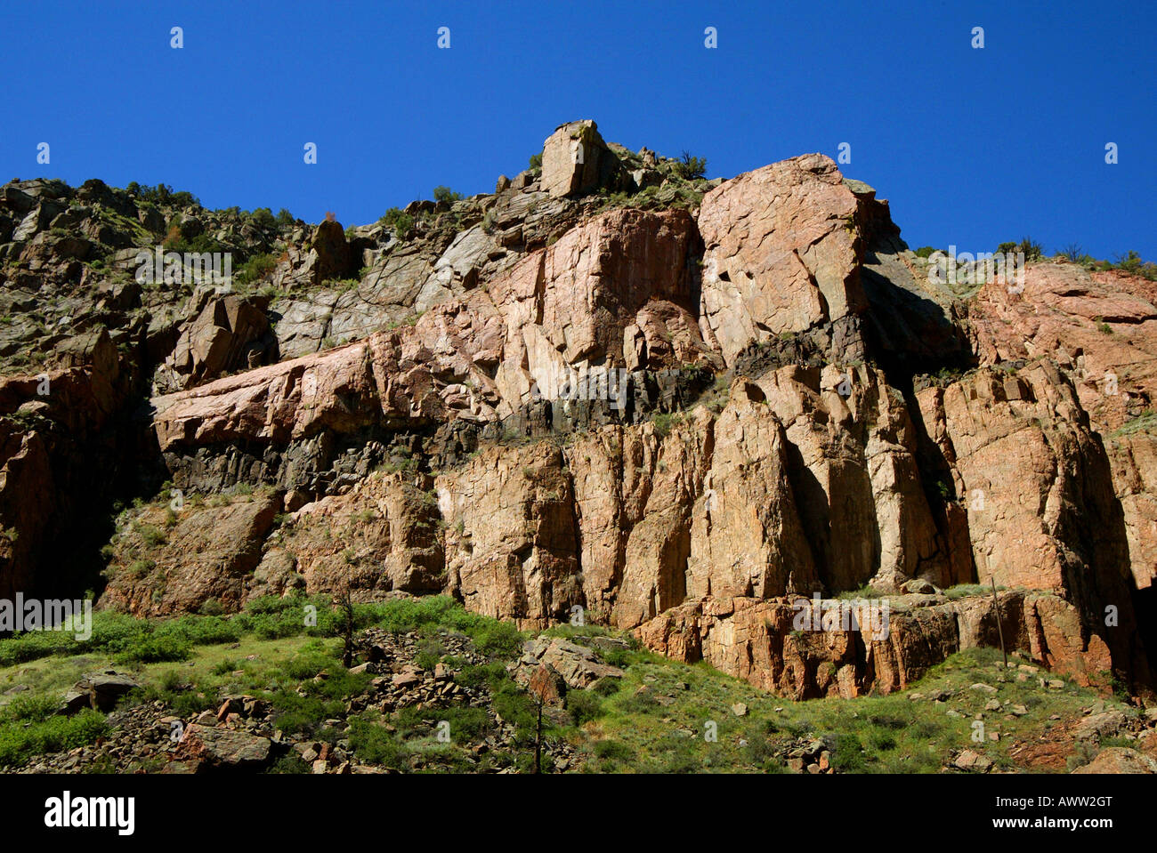 Different colored layers of stone make up the walls of Royal Gorge ...