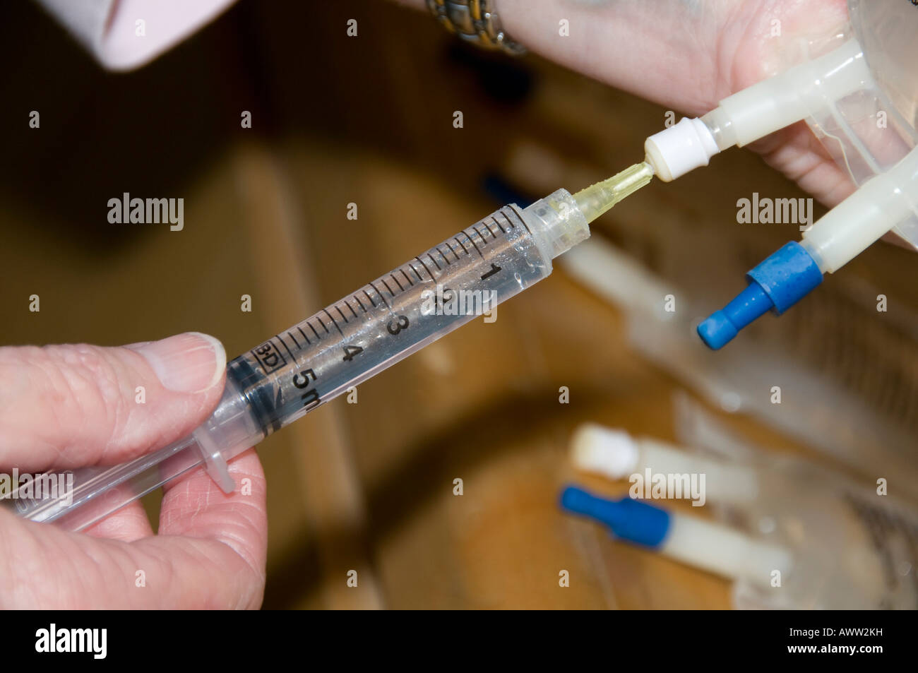 Nurse Preparing IV Medication For Patient Stock Photo - Alamy