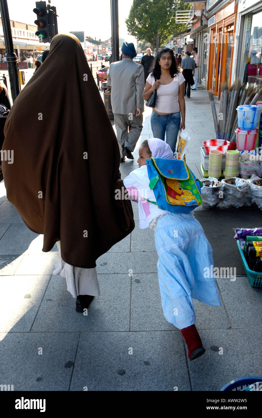 Street scene of people in Southall Middlesex Stock Photo - Alamy