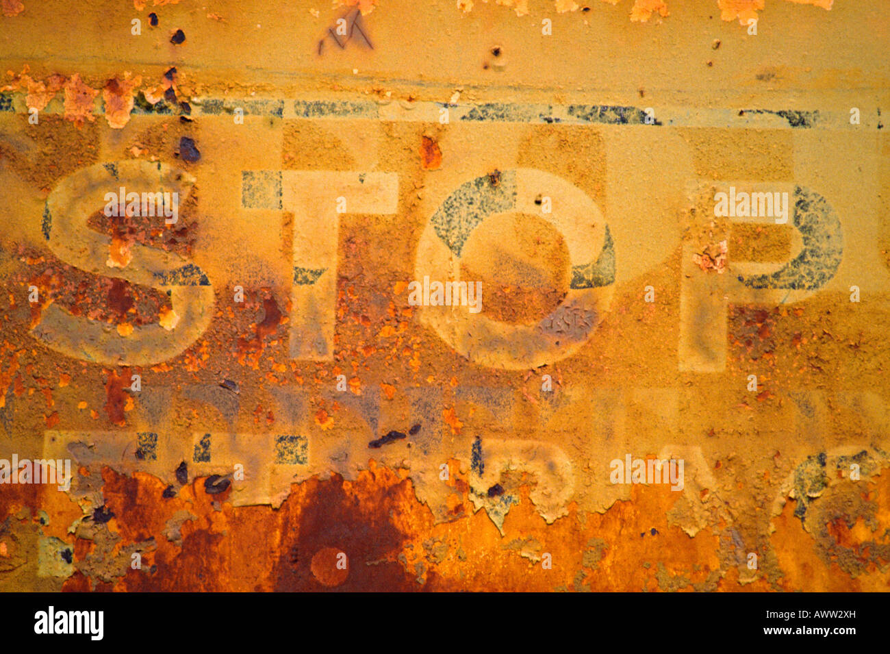 Weathered stop caution sign Stock Photo - Alamy