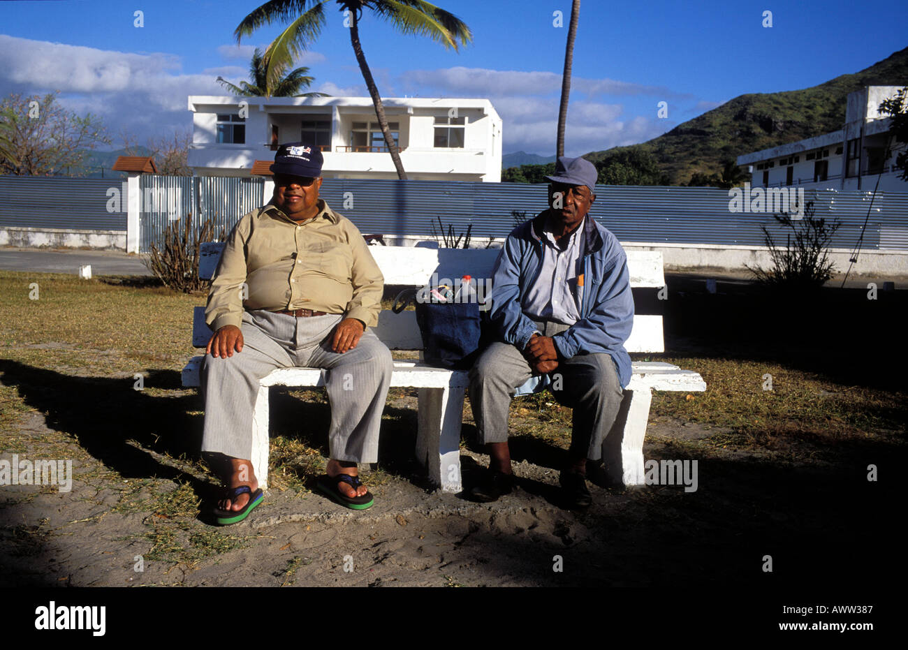 2 men sitting on Bench Mauritius Stock Photo - Alamy