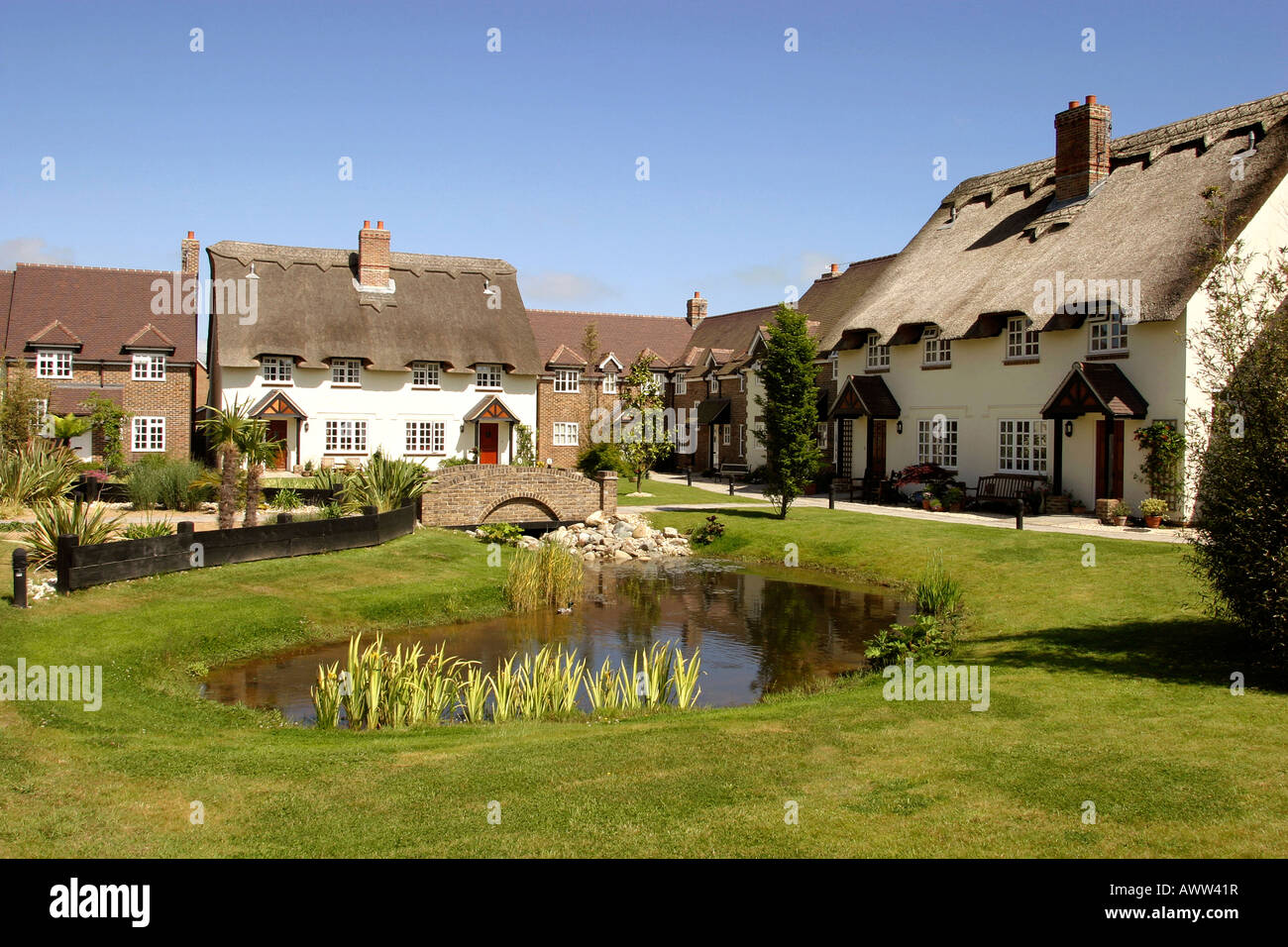 UK West Sussex Clymping Waterford Gardens the village green and pond ...