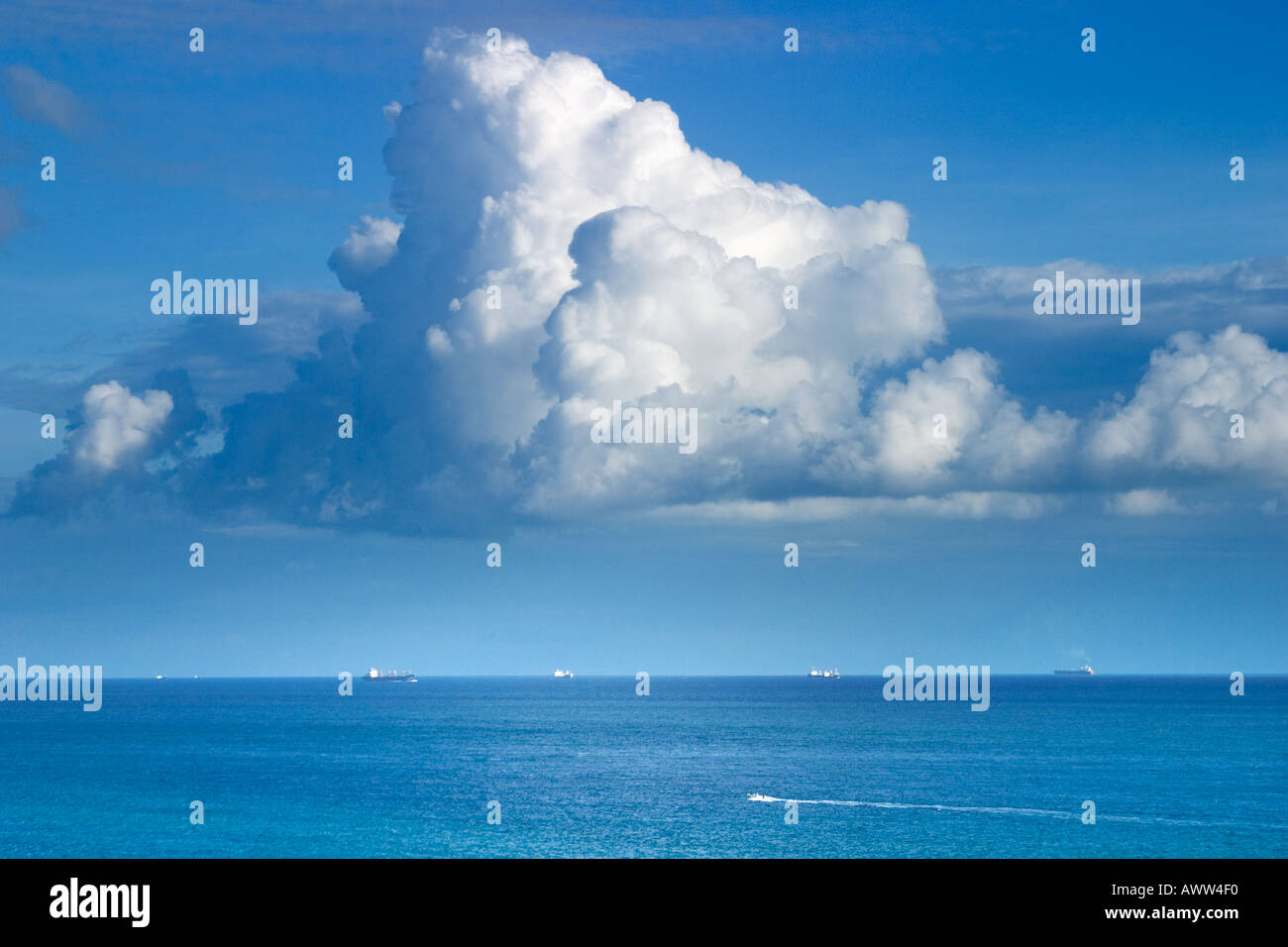 Shipping under cumulus cloud formation Stock Photo - Alamy