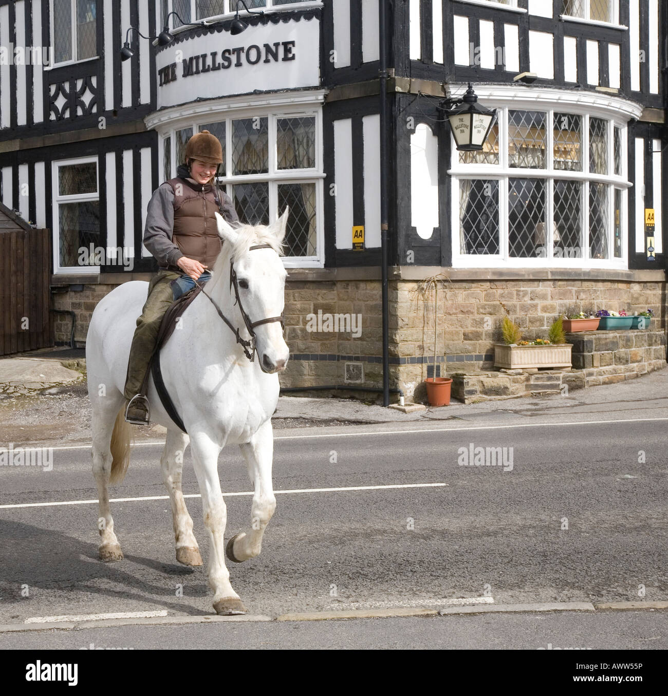 Riding a White Horse; mounted female horse leisure rider in Hathersage ...