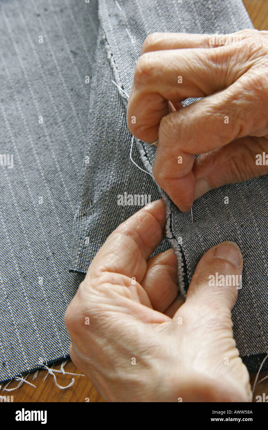 Older hands sewing Stock Photo - Alamy