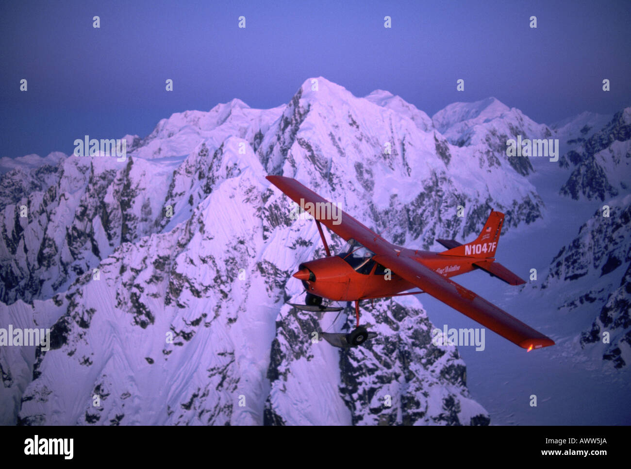 Bush plane over the Alaska United States Range dawn light on Mount ...