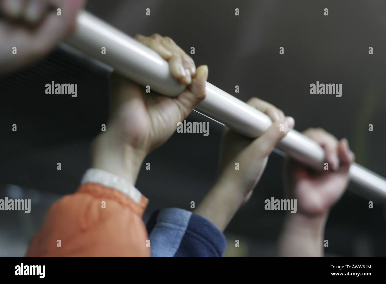 Hands on the Bar in the Subway Stock Photo - Alamy