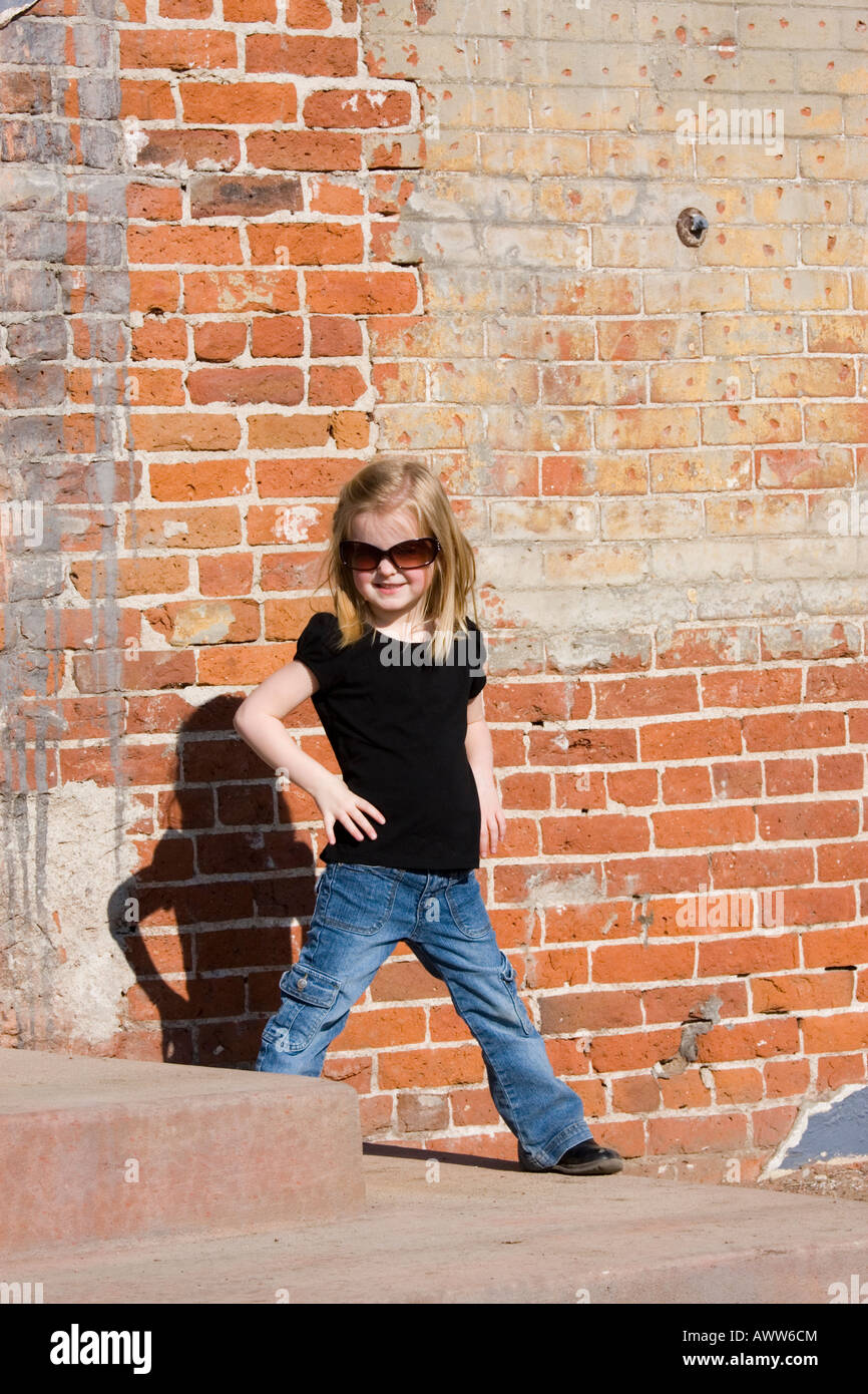 Young girl shows a sassy side in an abandoned part of downtown Stock ...