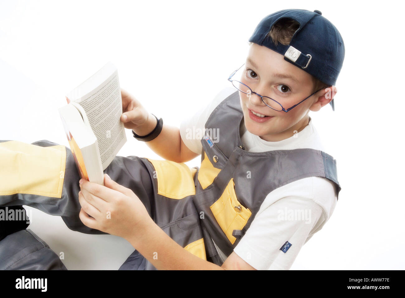 Boy holding book, reading Stock Photo - Alamy