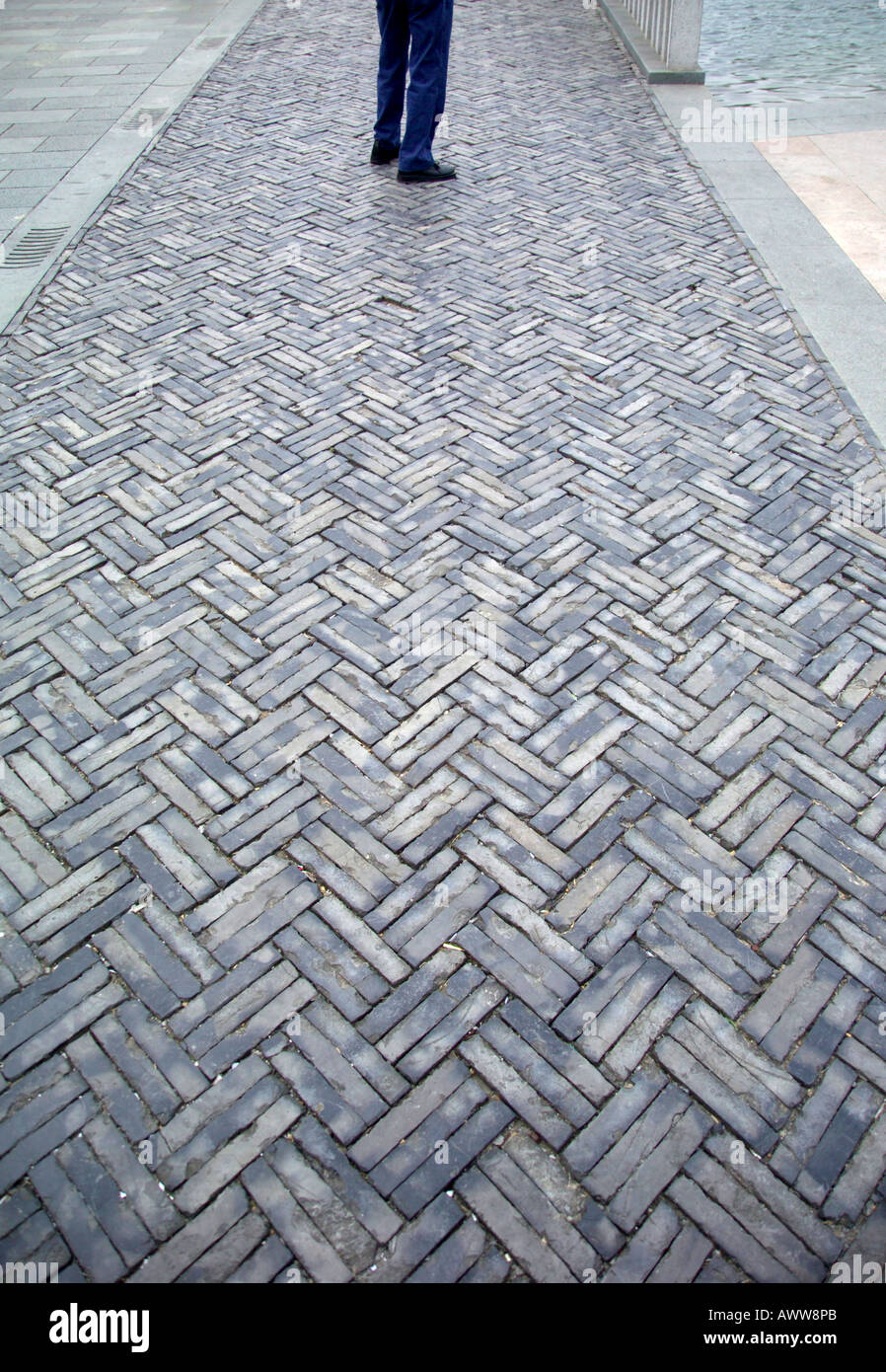 abstract stone brick floor with feet Stock Photo - Alamy