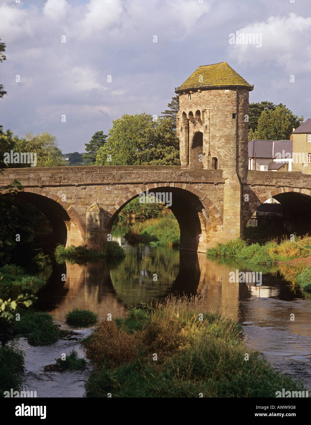 Medieval Monnow Bridge with fortified gate on stone arched bridge over ...