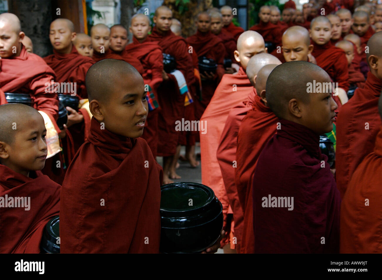 Monks queueing for second meal Mahagandayon monastery Stock Photo - Alamy