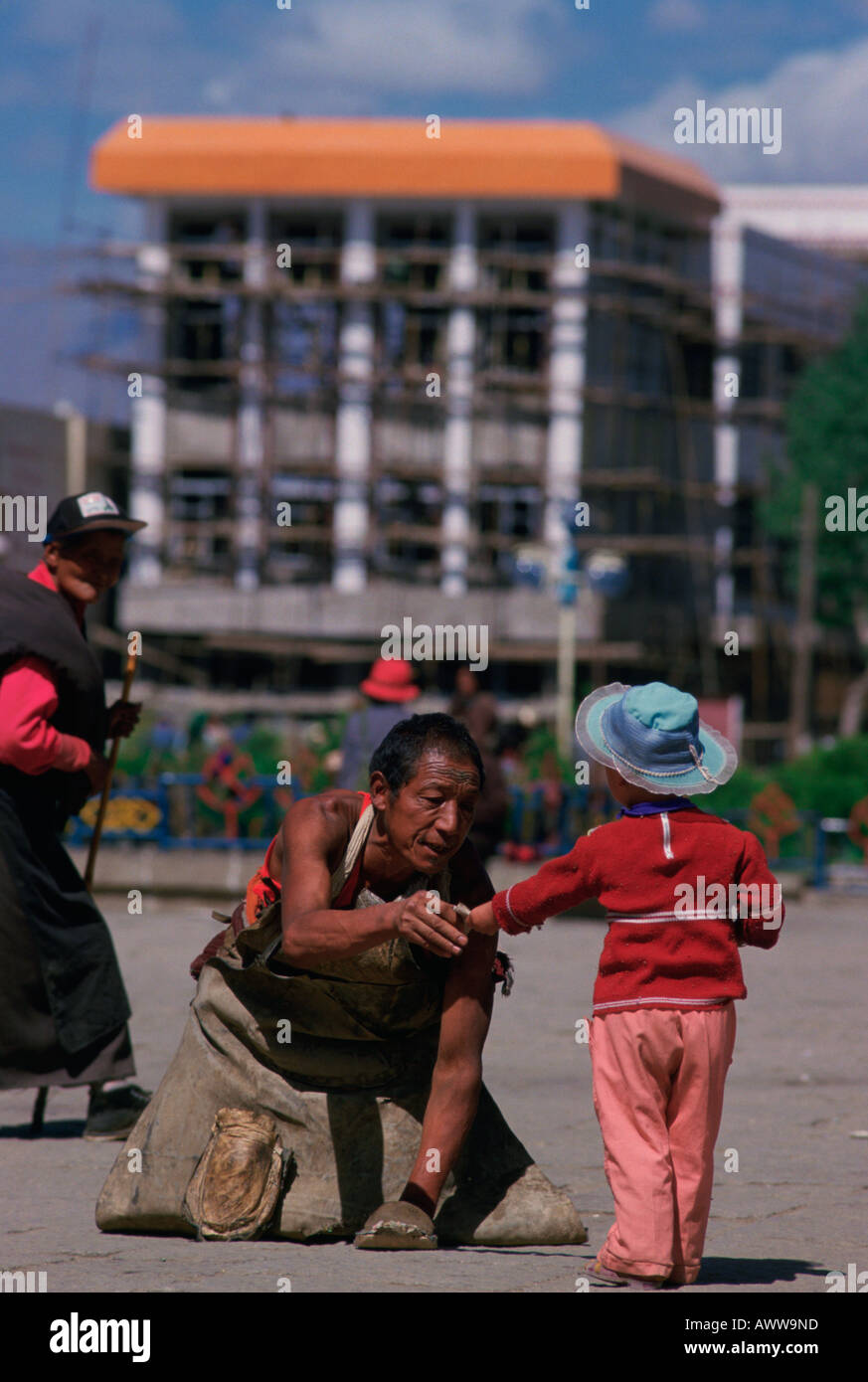 Child giving alms hi-res stock photography and images - Alamy