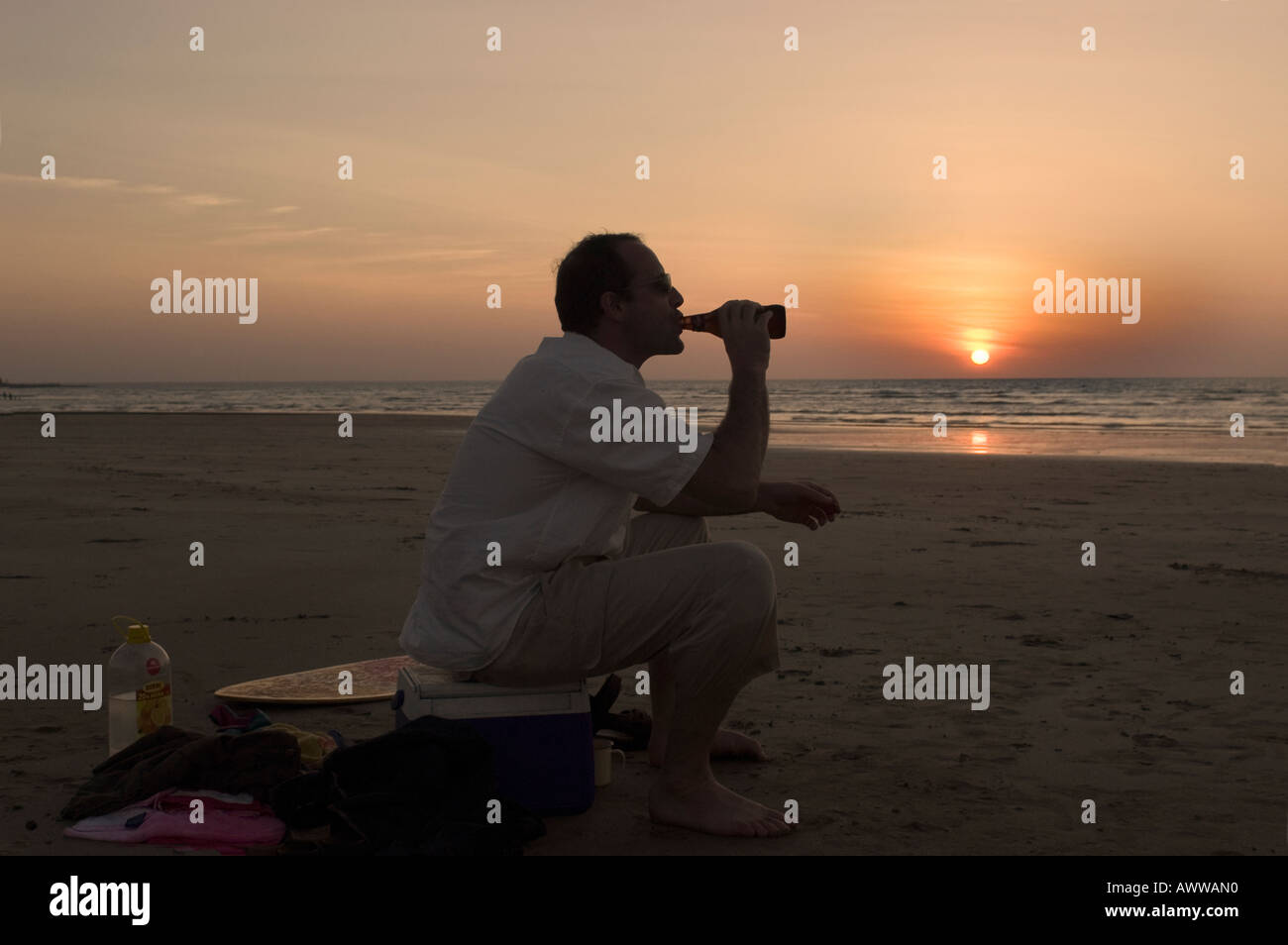 Darwin Sundowner on Beach Stock Photo - Alamy
