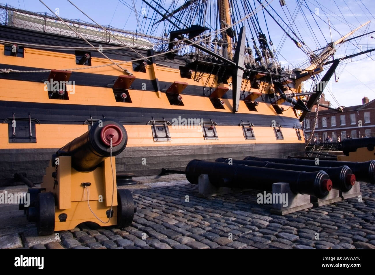 The Starboard side of HMS Victory with a Canon in the foreground Stock ...
