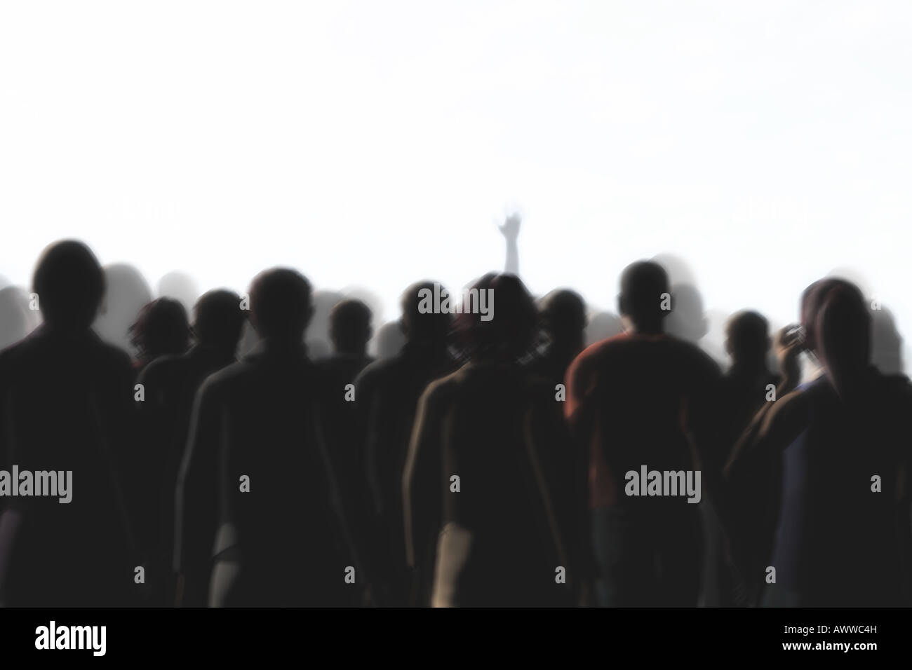 Raised hand in a crowd Stock Photo - Alamy