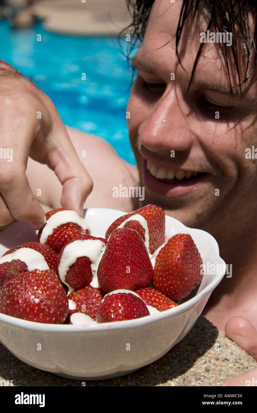 Man eating in pool hi-res stock photography and images - Alamy