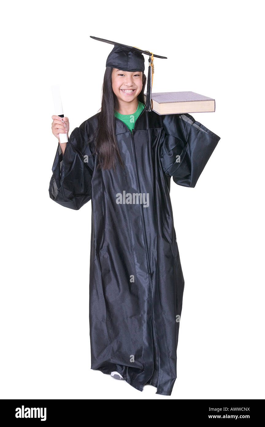Girl in Graduation Gown Balancing Book on Her Shoulder Stock Photo - Alamy