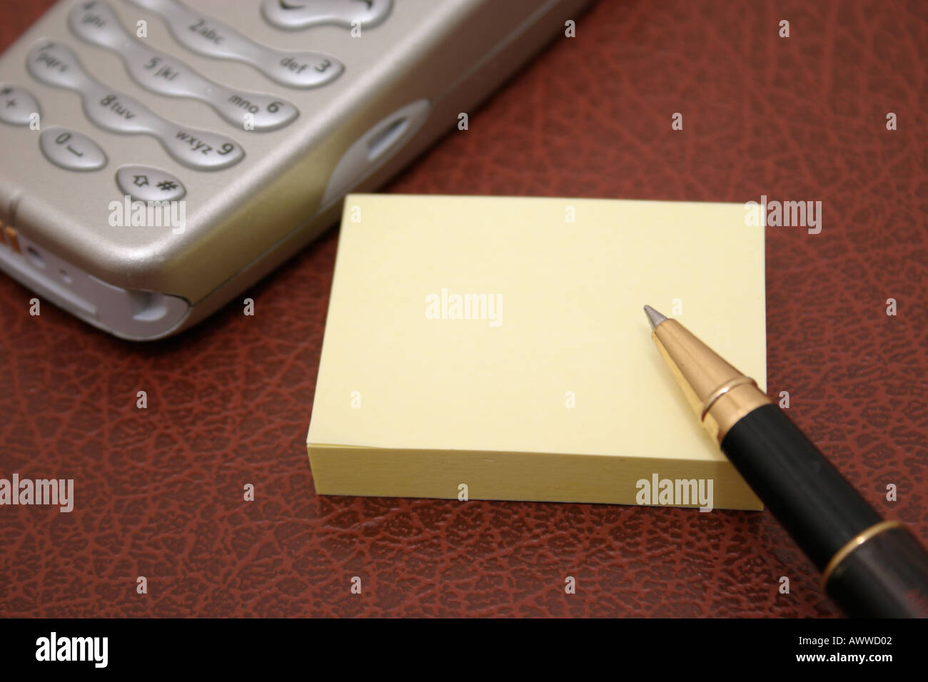 a blank pad of post it and pen beside cellphone horizontal Concept for ...