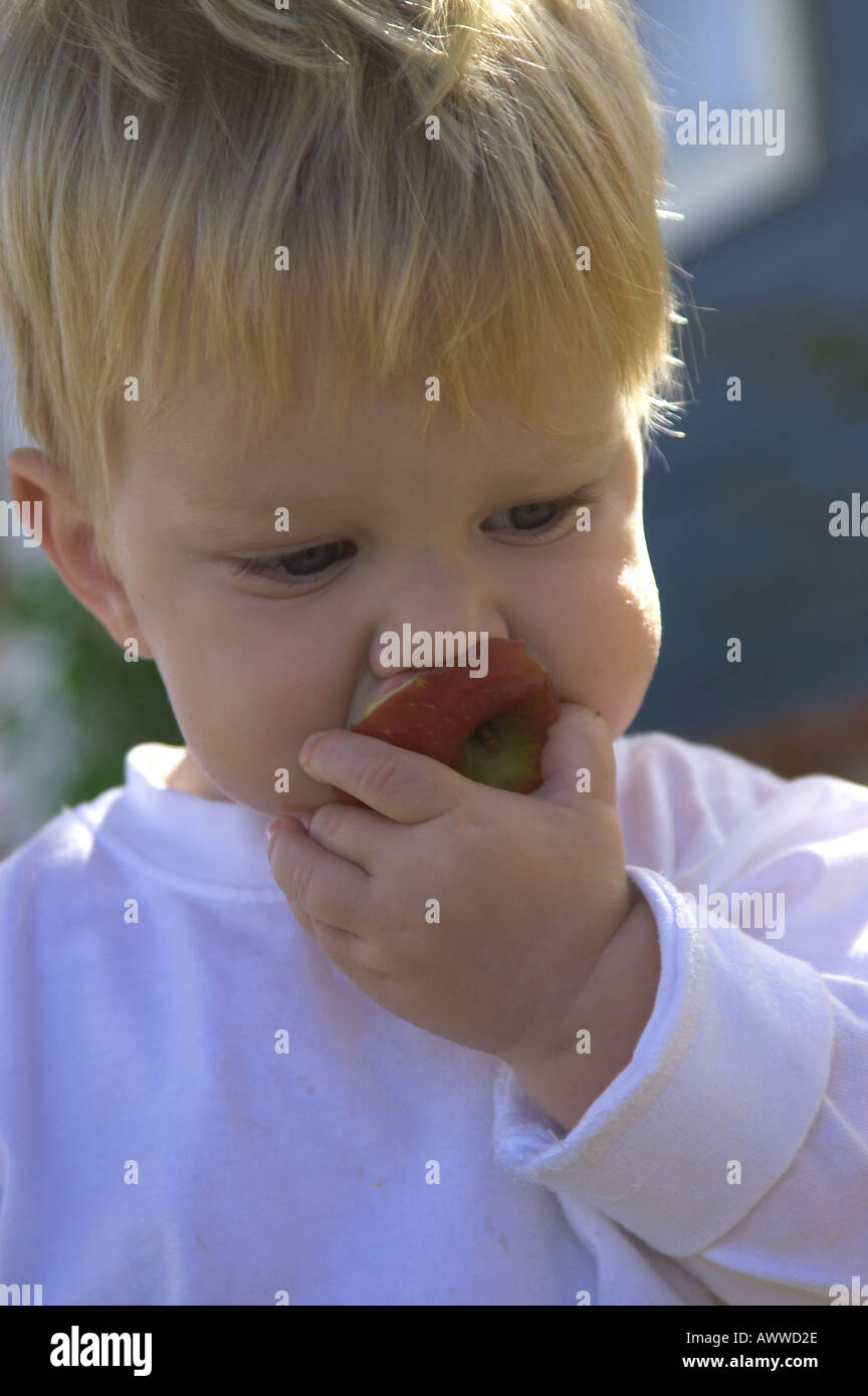 toddler with apple Stock Photo - Alamy