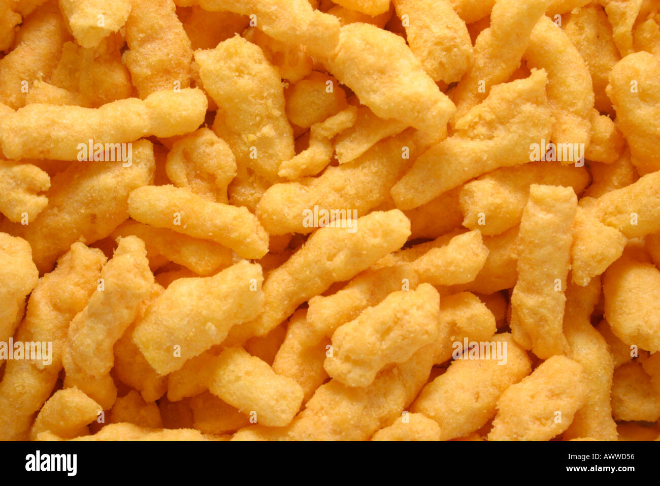 yellow curled crispy corn snacks Stock Photo - Alamy