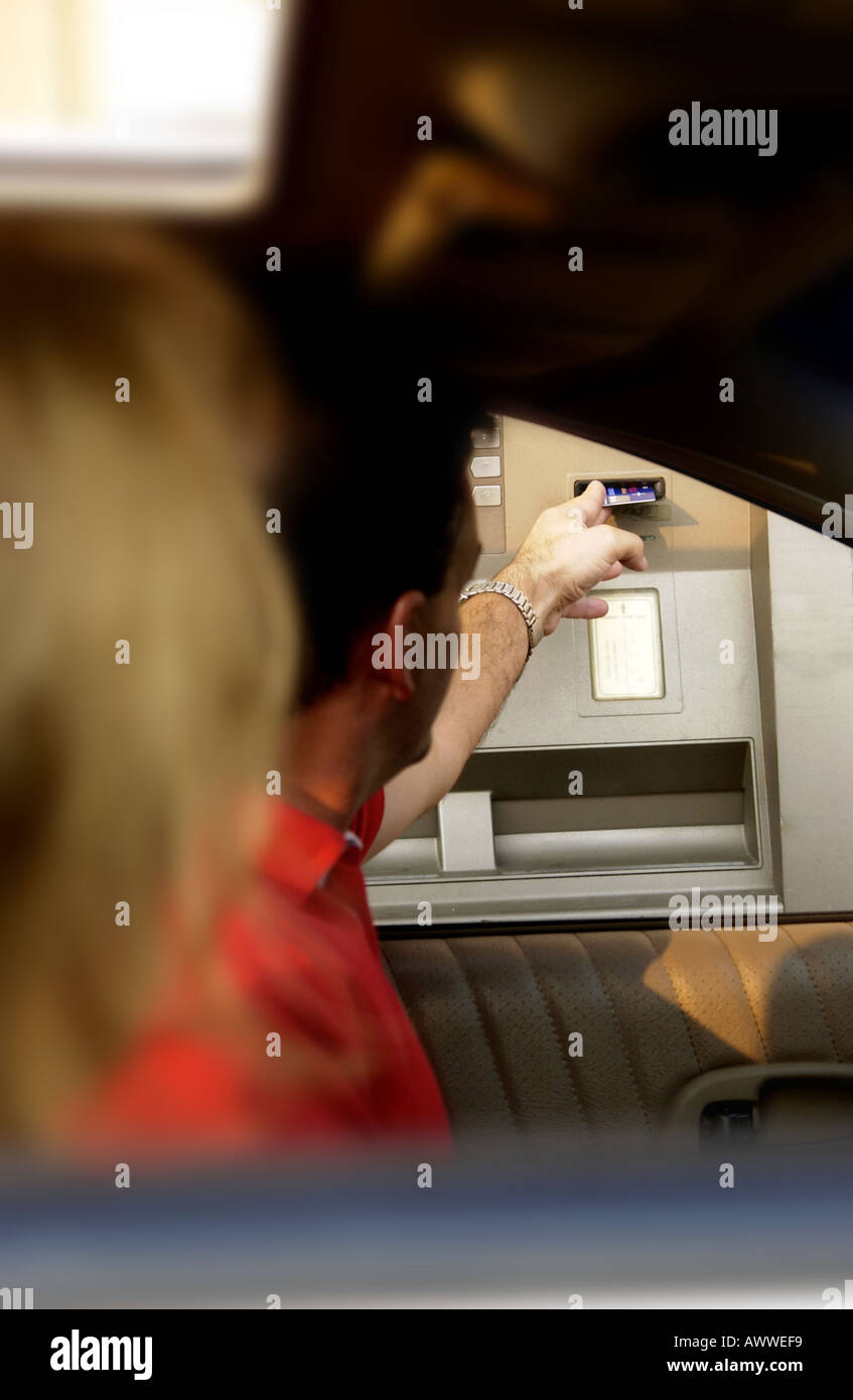 Man depositing money atm hi-res stock photography and images - Alamy