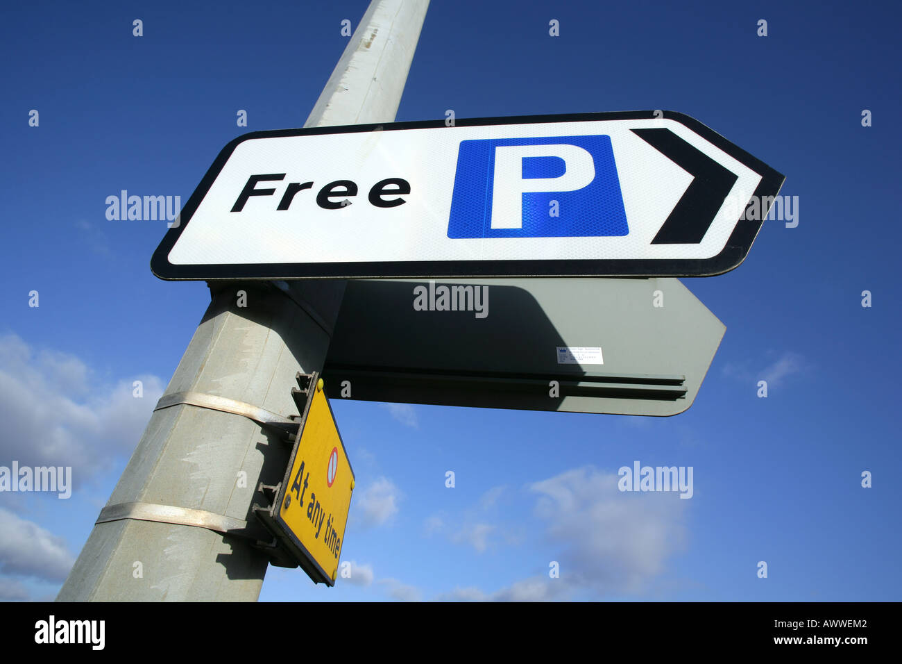 A "free parking" road sign attached to a lampost, Essex, England, UK ...