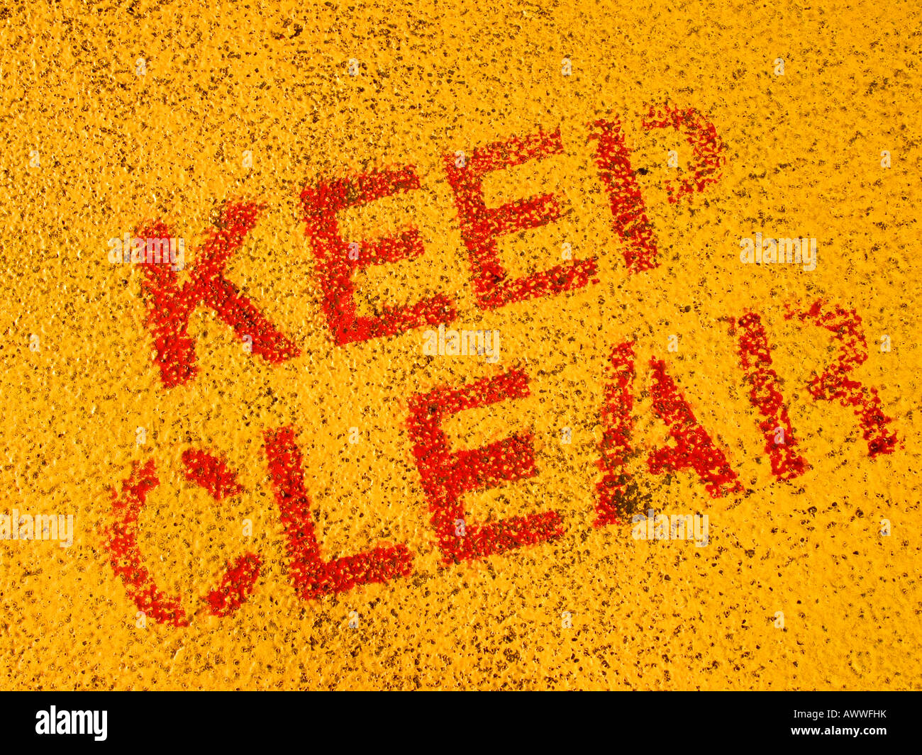 Painted warning sign to keep clear Stock Photo - Alamy