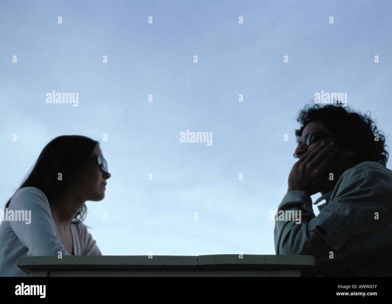 Couple opposite each other table hi-res stock photography and images ...