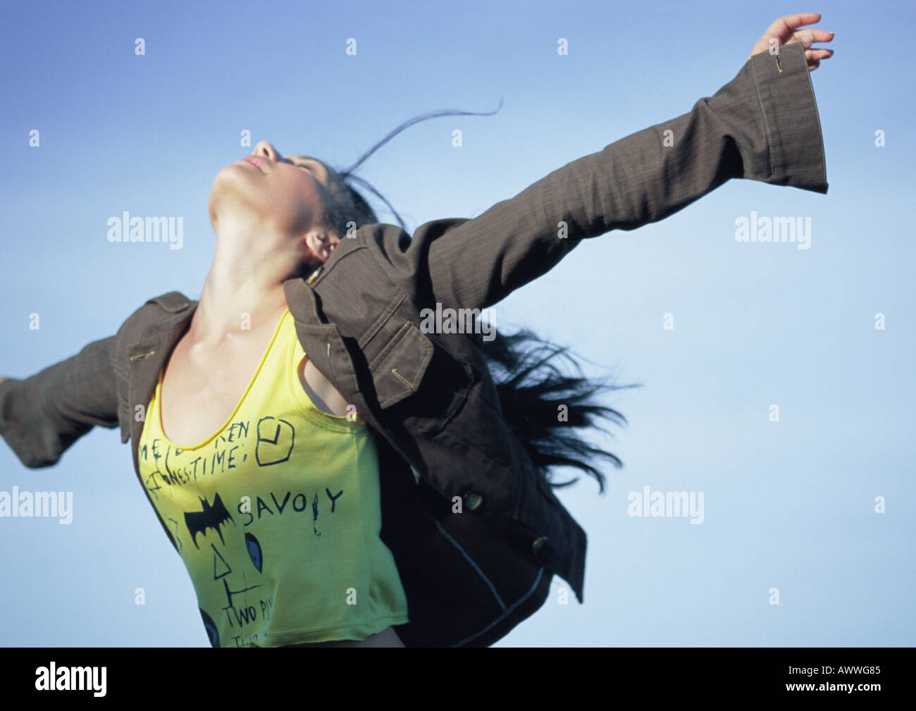 Woman with head back and open arms hi-res stock photography and images ...