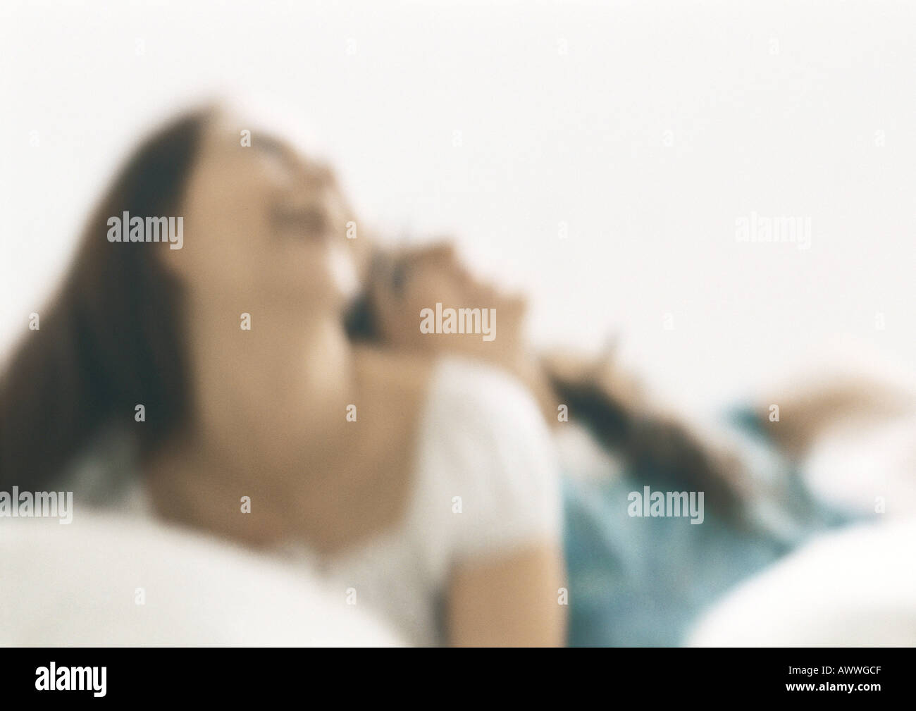 Two women laughing, blurred Stock Photo - Alamy