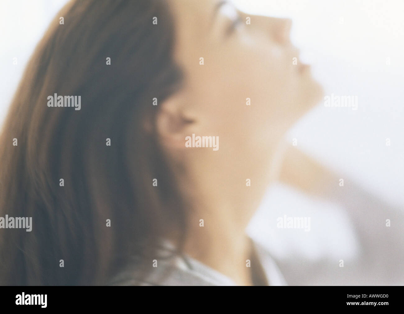 Woman leaning head back, close-up, blurred Stock Photo - Alamy
