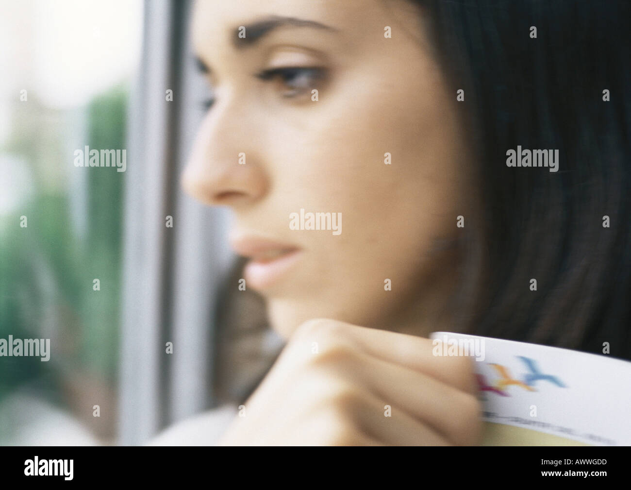 Woman looks through window indoors hi-res stock photography and images ...