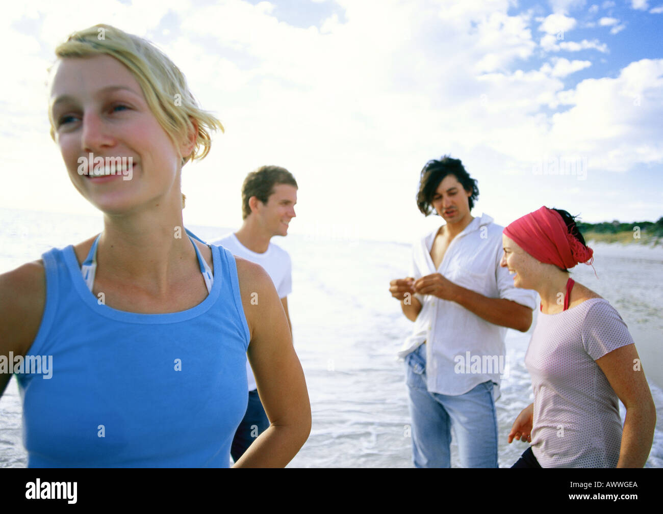 Group of people on beach Stock Photo - Alamy