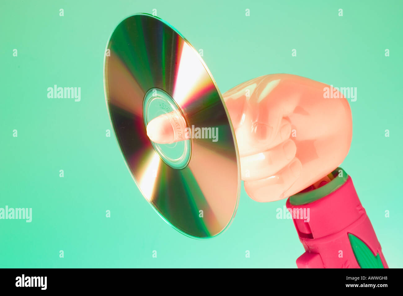 Toy Hand with CD Stock Photo - Alamy