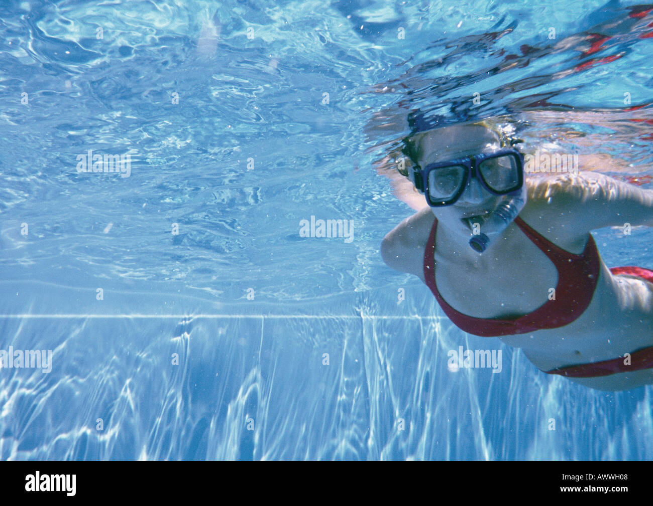 Young woman snorkeling in pool Stock Photo - Alamy