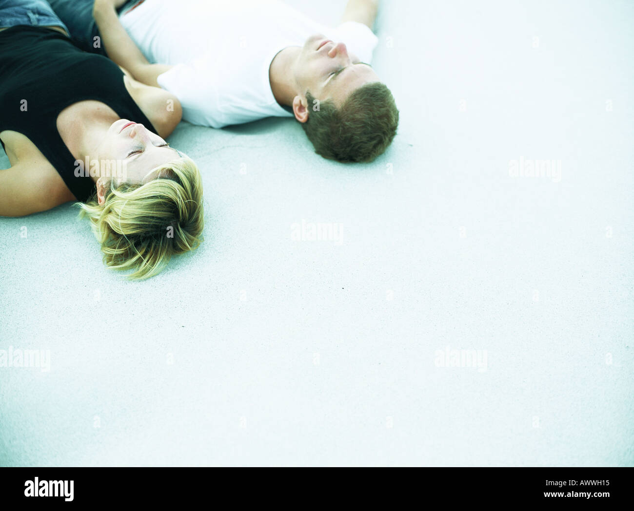 Man and woman lying side by side, elevated view Stock Photo - Alamy